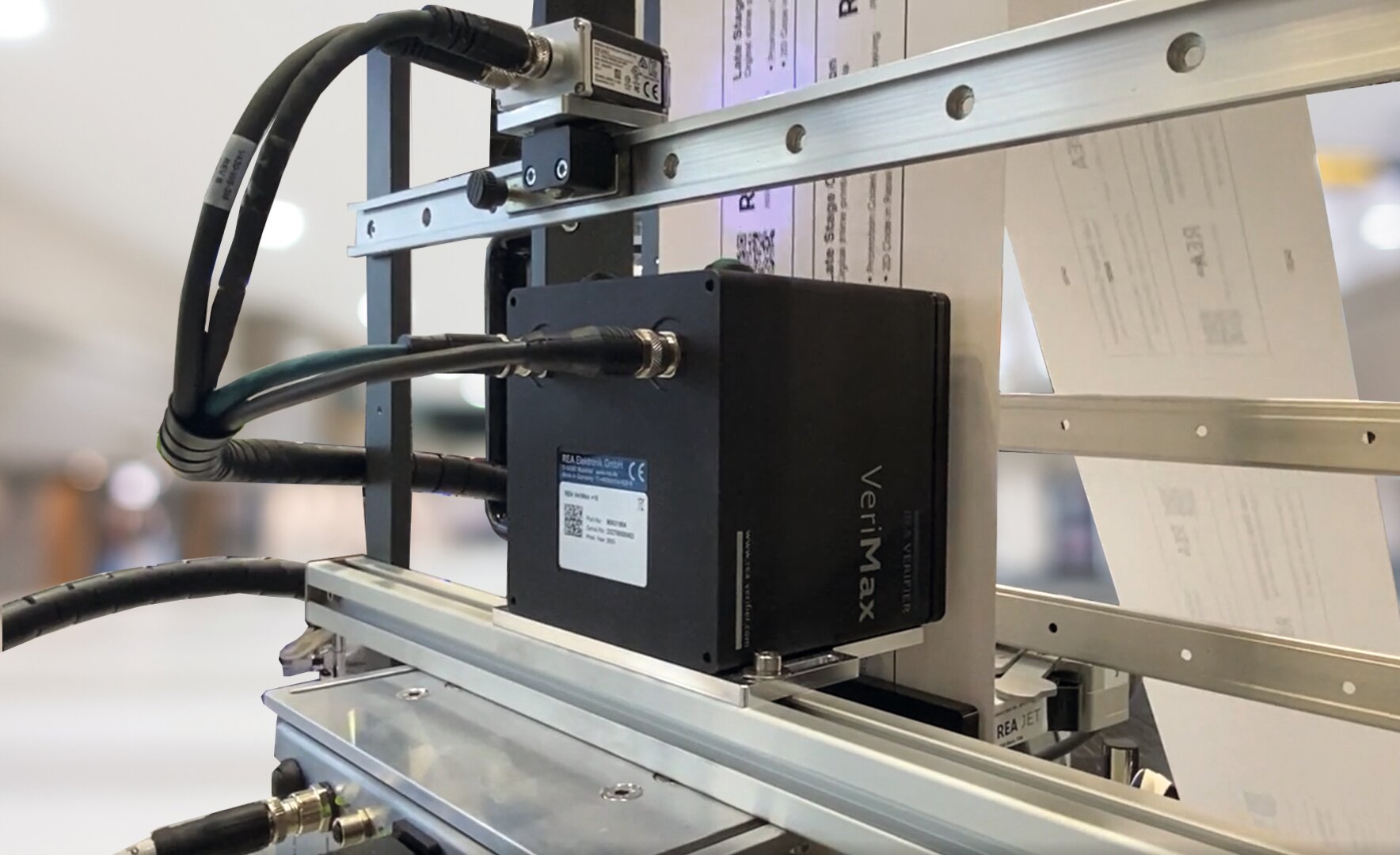 Marking, laser cutting, labeling and verifying paper and cardboard